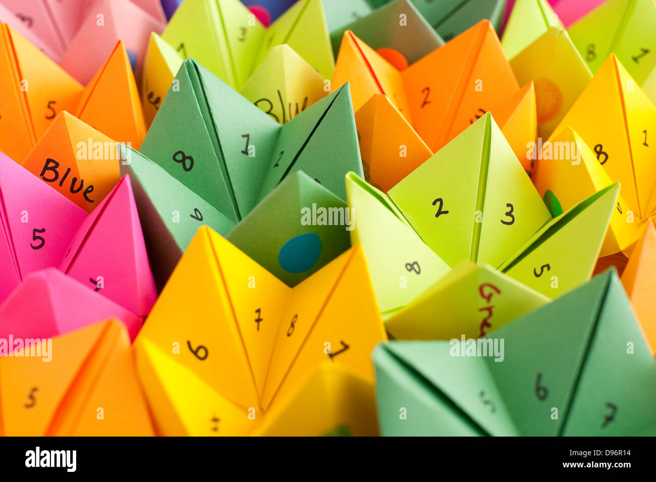 Multicolored cootie catchers, origami fortune teller with numbers and ...
