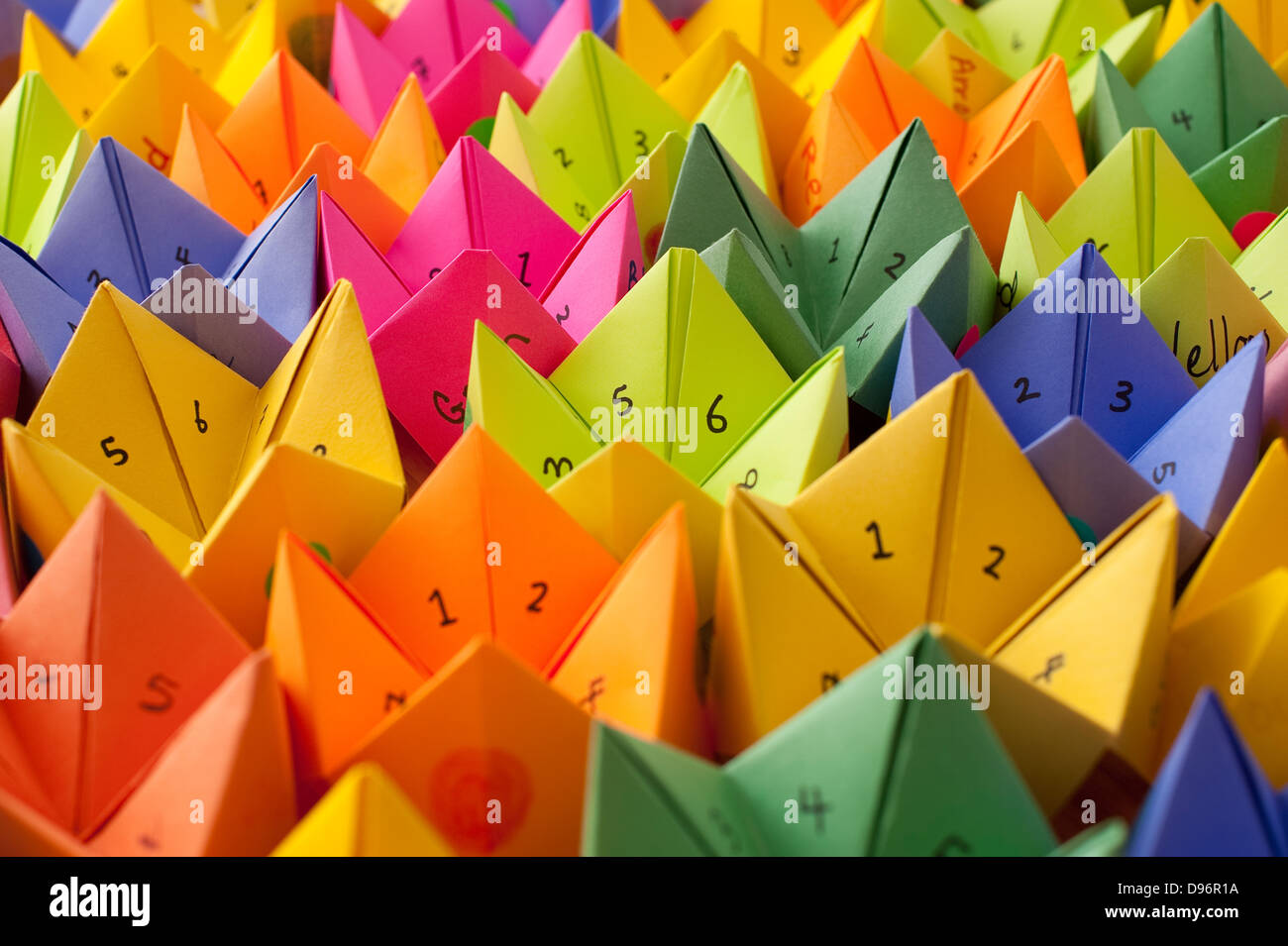 Multicolored cootie catchers, origami fortune teller with numbers and ...