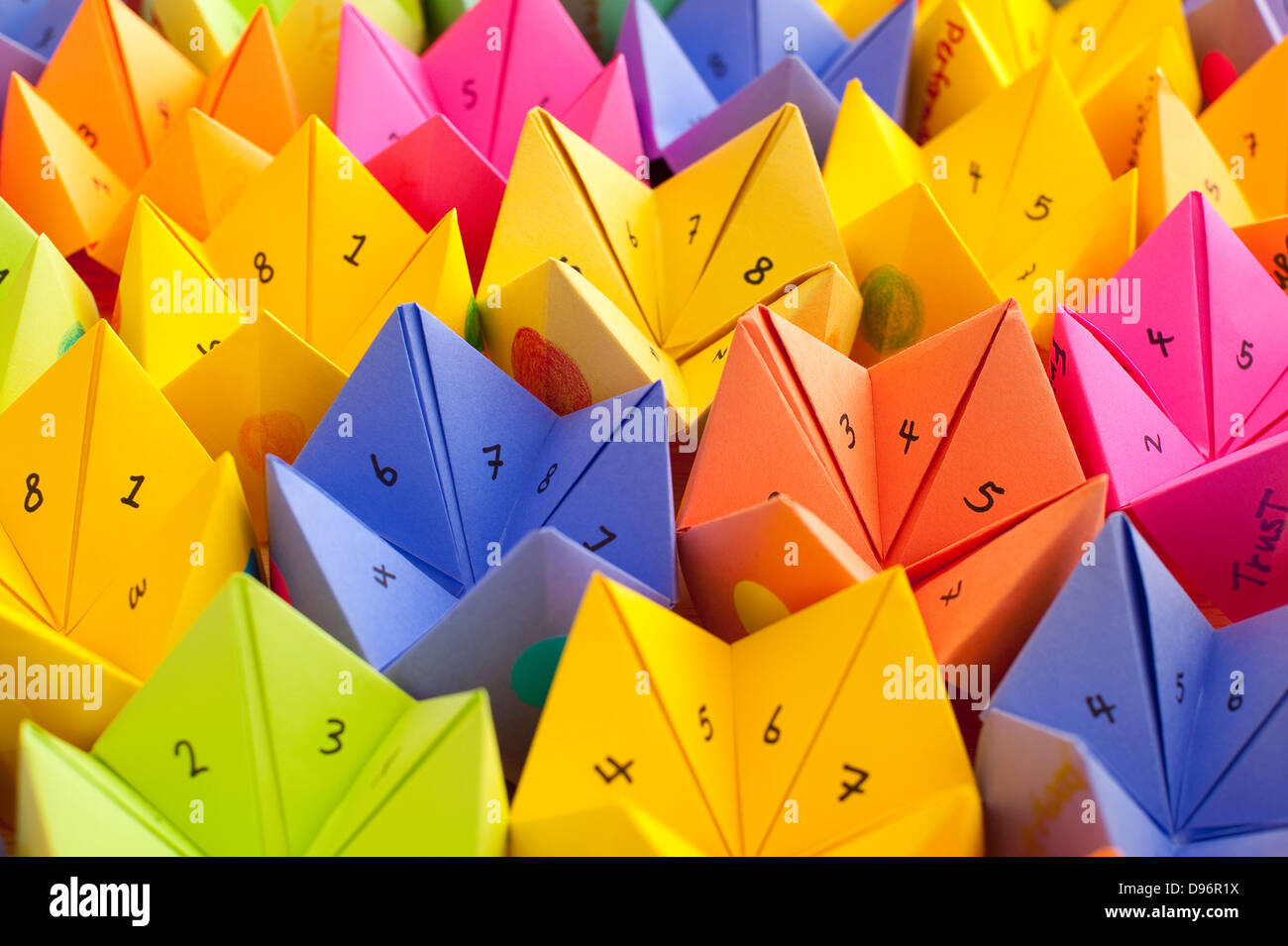 Multicolored cootie catchers, origami fortune teller with numbers and ...