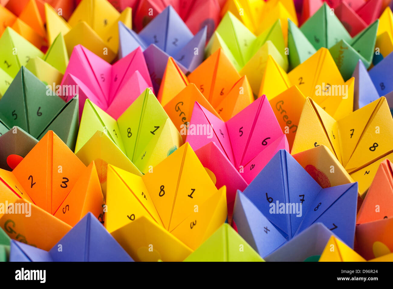 Multicolored cootie catchers, origami fortune teller with numbers and ...