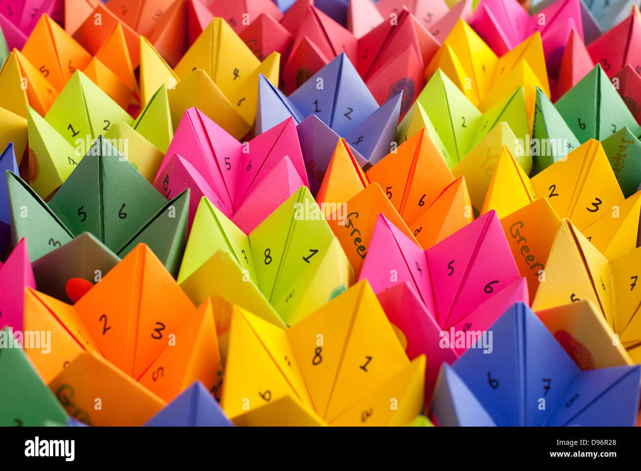 Multicolored cootie catchers, origami fortune teller with numbers and ...