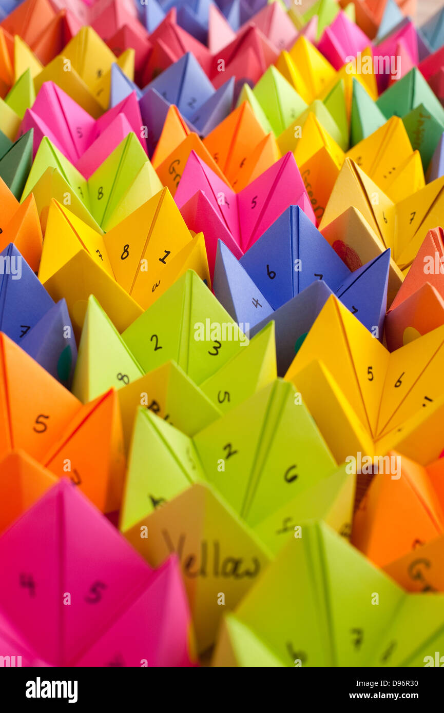Multicolored cootie catchers, origami fortune teller with numbers and ...