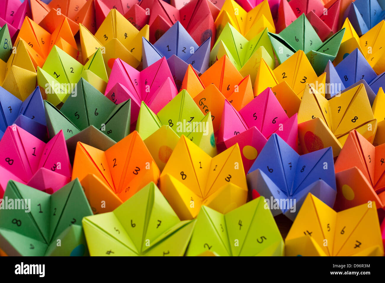 Multicolored cootie catchers, origami fortune teller with numbers and ...