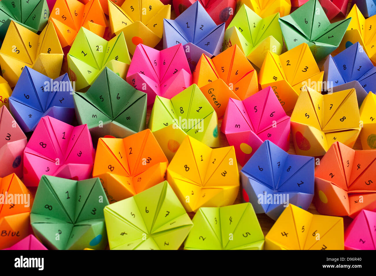 Multicolored cootie catchers, origami fortune teller with numbers and ...
