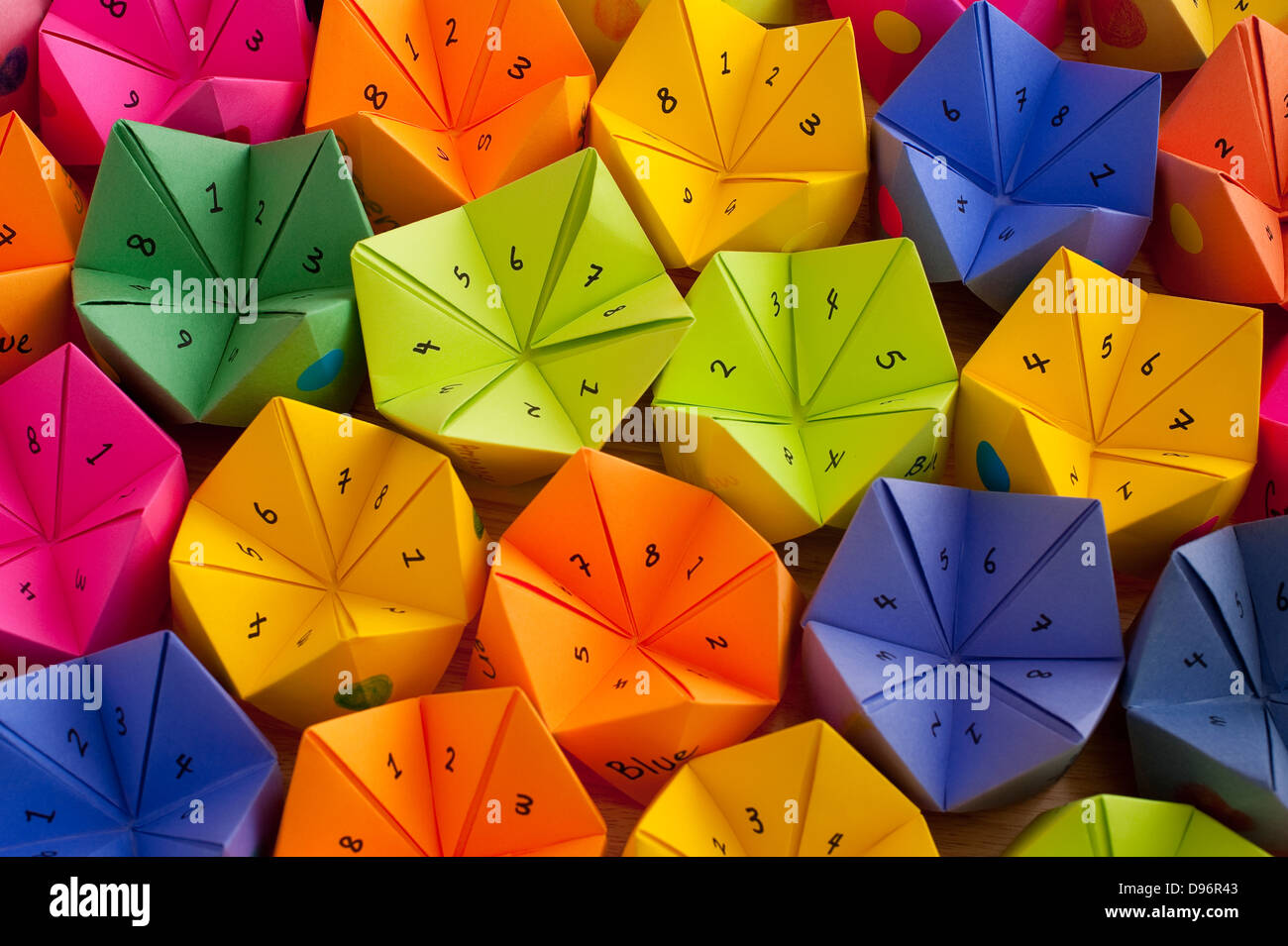 Multicolored cootie catchers, origami fortune teller with numbers and ...