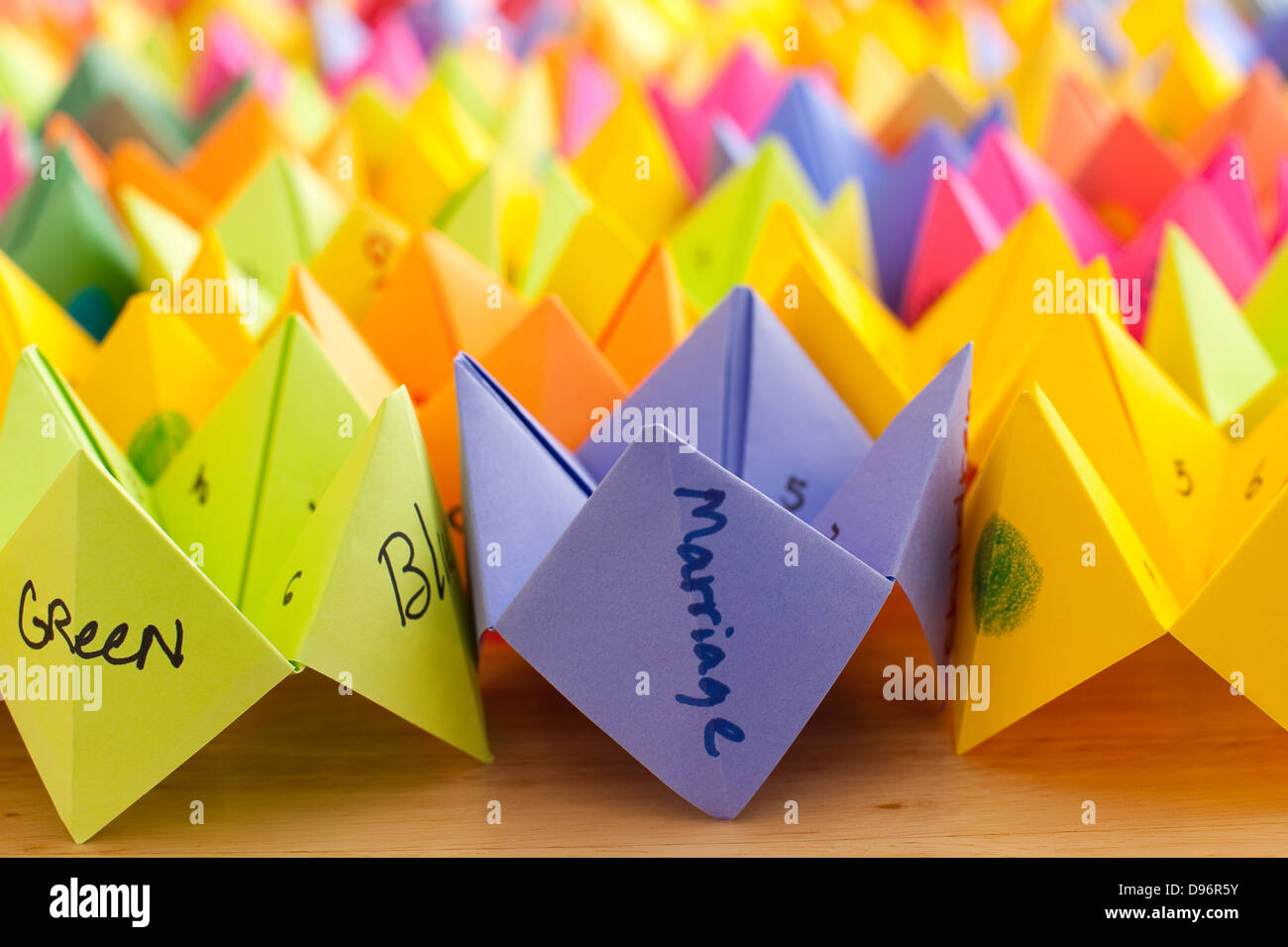 Multicolored cootie catchers, origami fortune teller with numbers and ...
