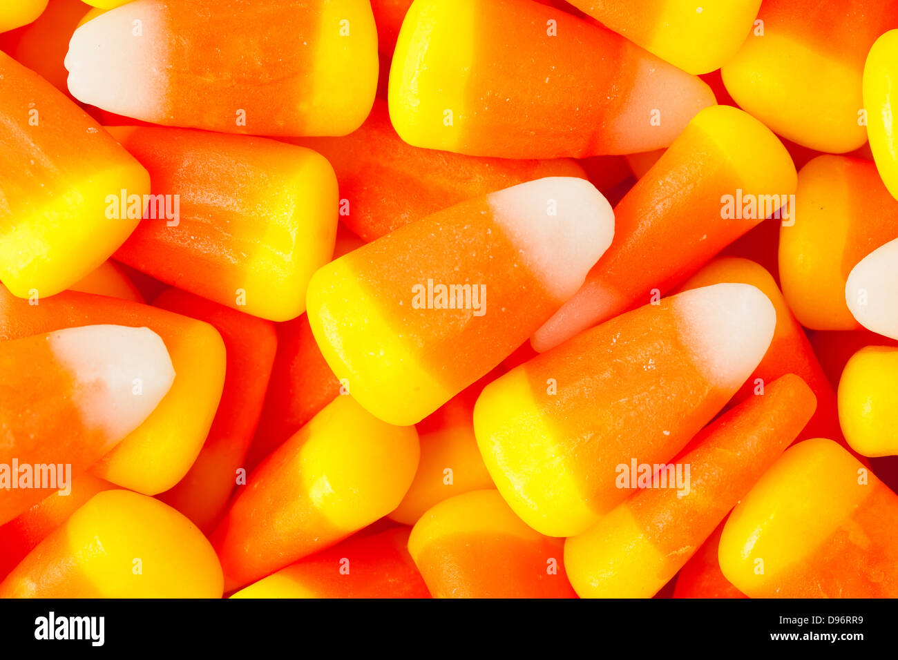 Halloween Striped Candy Corn against a background Stock Photo - Alamy