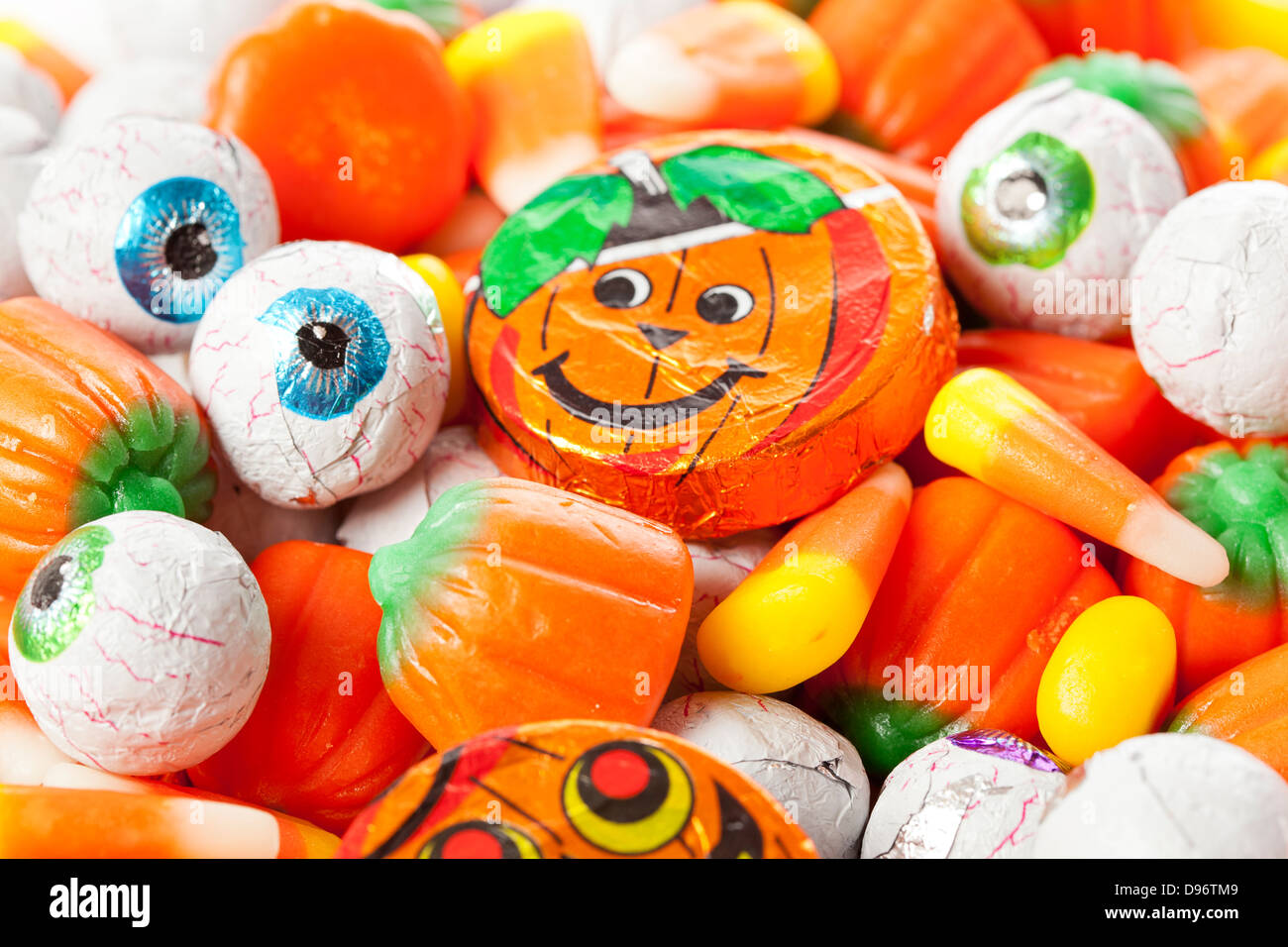 Spooky Orange Halloween Candy against a background Stock Photo - Alamy