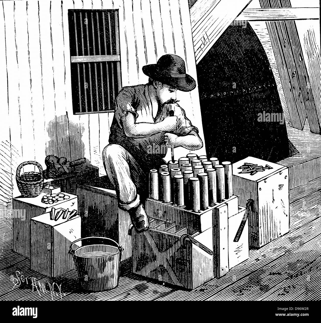 Inserting detonators into cartridges of dynamite for blasting Flood ...