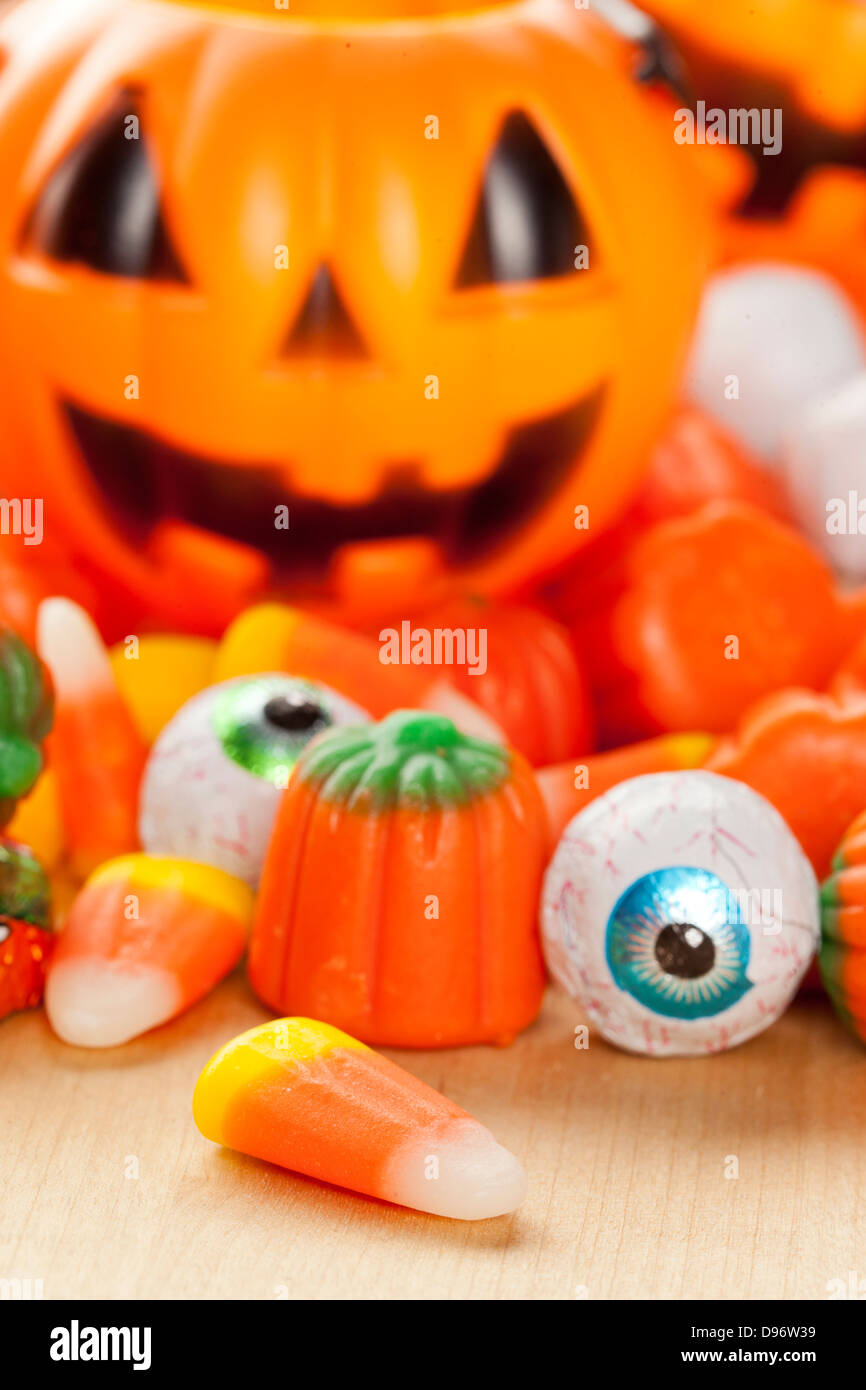 Spooky Orange Halloween Candy against a background Stock Photo - Alamy