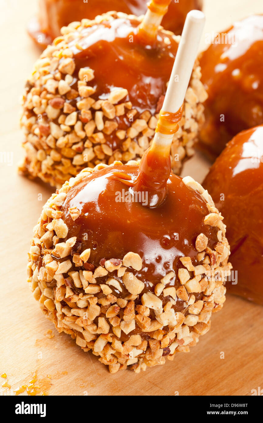 Homemade Taffy Apple with Peanuts against a back ground Stock Photo - Alamy