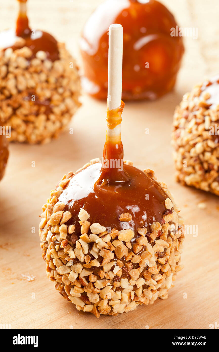 Homemade Taffy Apple with Peanuts against a back ground Stock Photo - Alamy