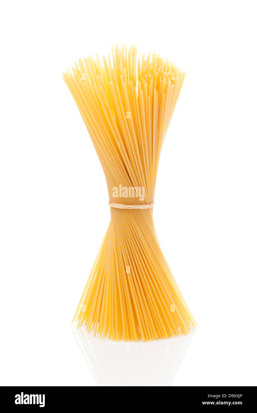 A Bundle of dry spaghetti ready to cook Stock Photo - Alamy