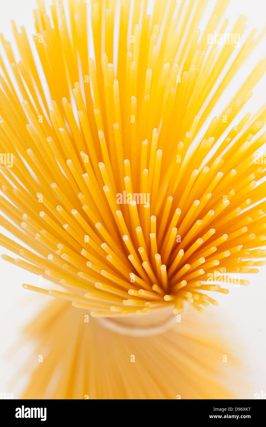 A Bundle of dry spaghetti ready to cook Stock Photo - Alamy