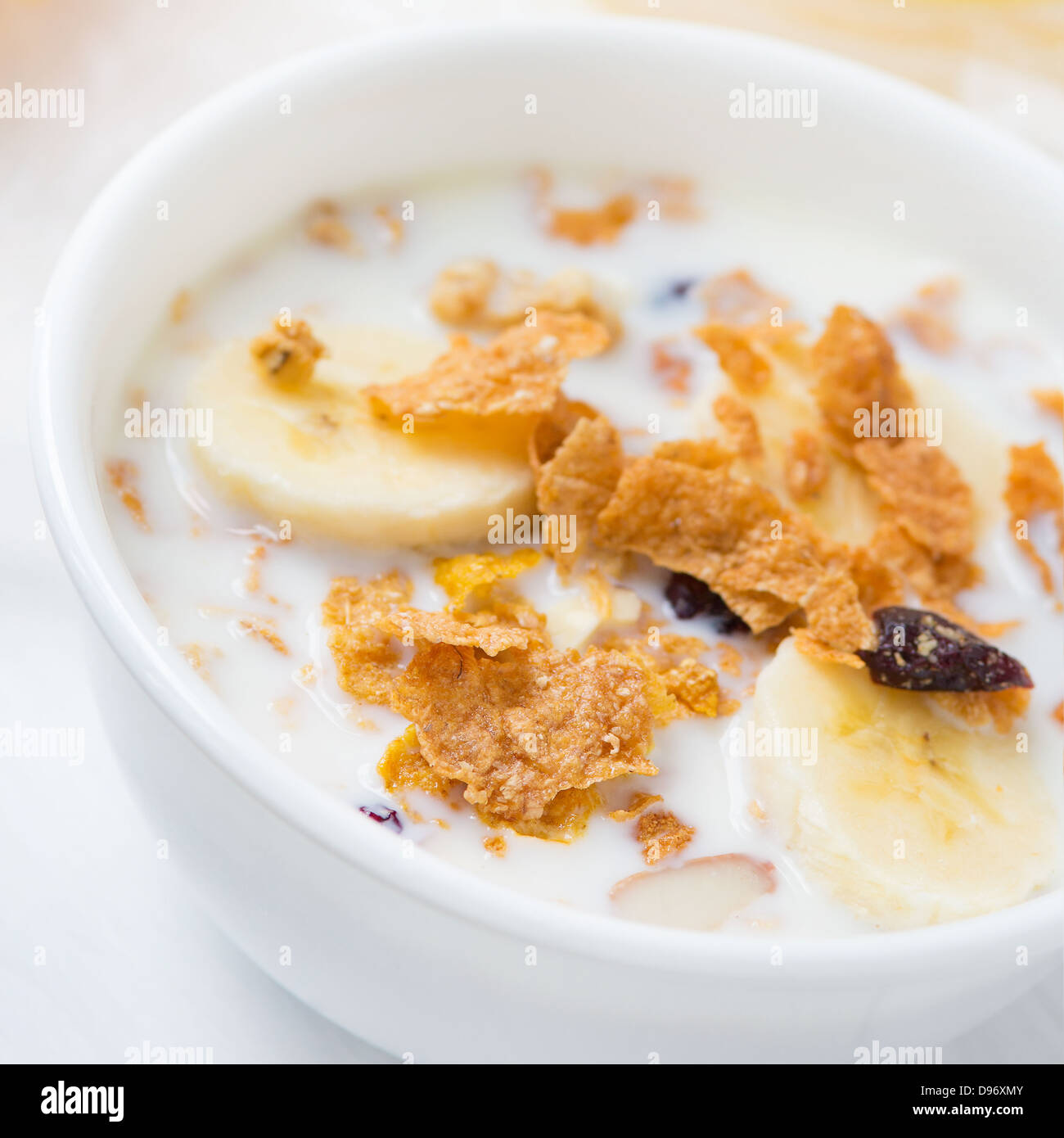 Whole grain cereal with cranberries and slices of banana breakfast ...