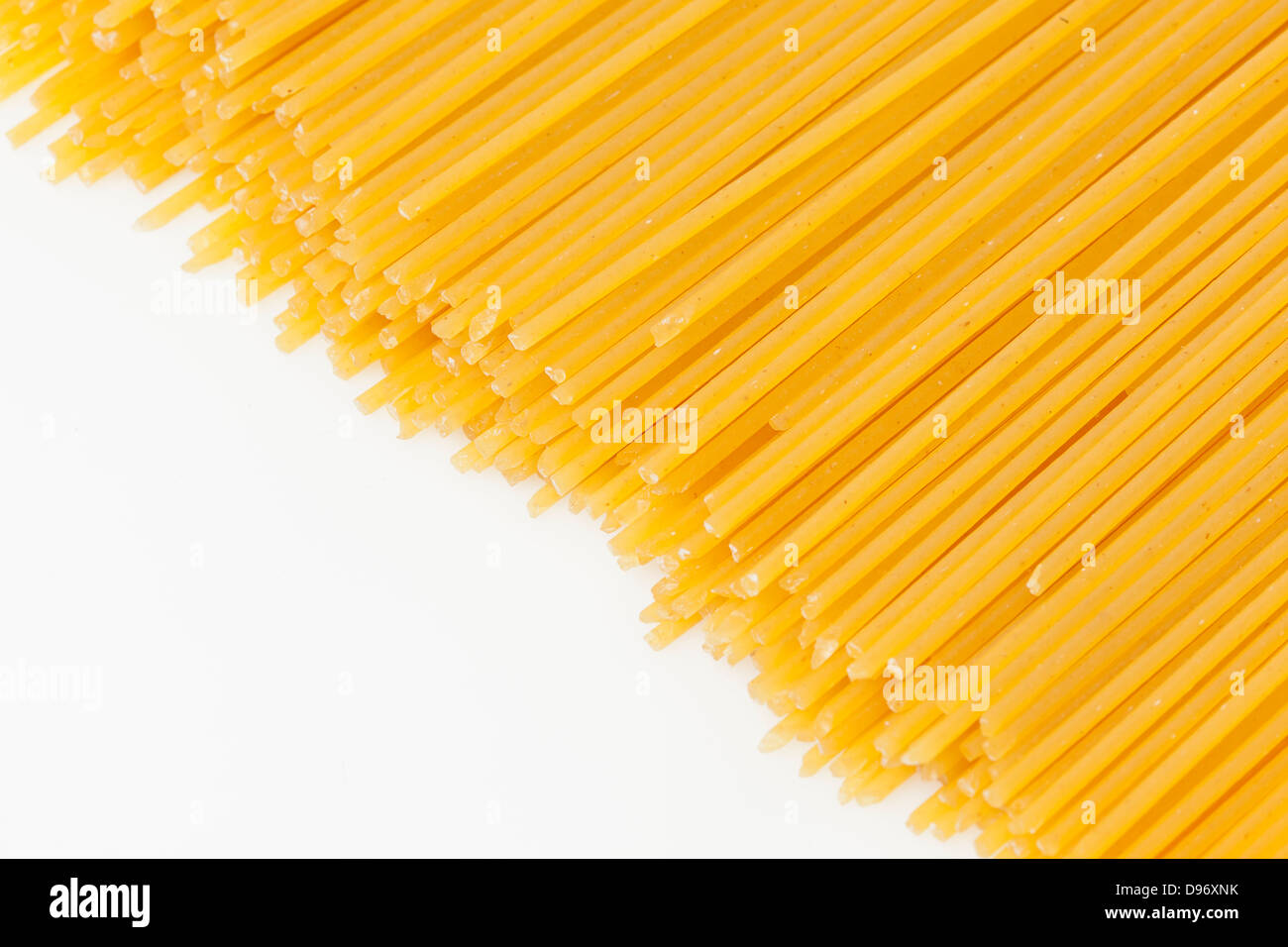 A Bundle of dry spaghetti ready to cook Stock Photo - Alamy