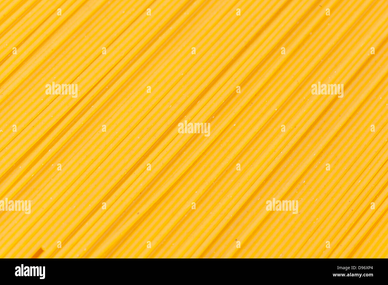 A Bundle of dry spaghetti ready to cook Stock Photo - Alamy