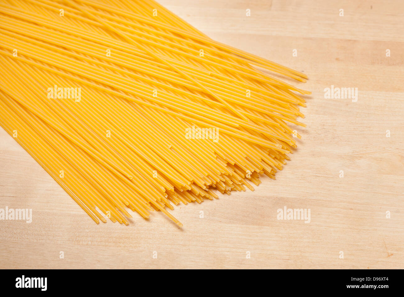 A Bundle of dry spaghetti ready to cook Stock Photo - Alamy