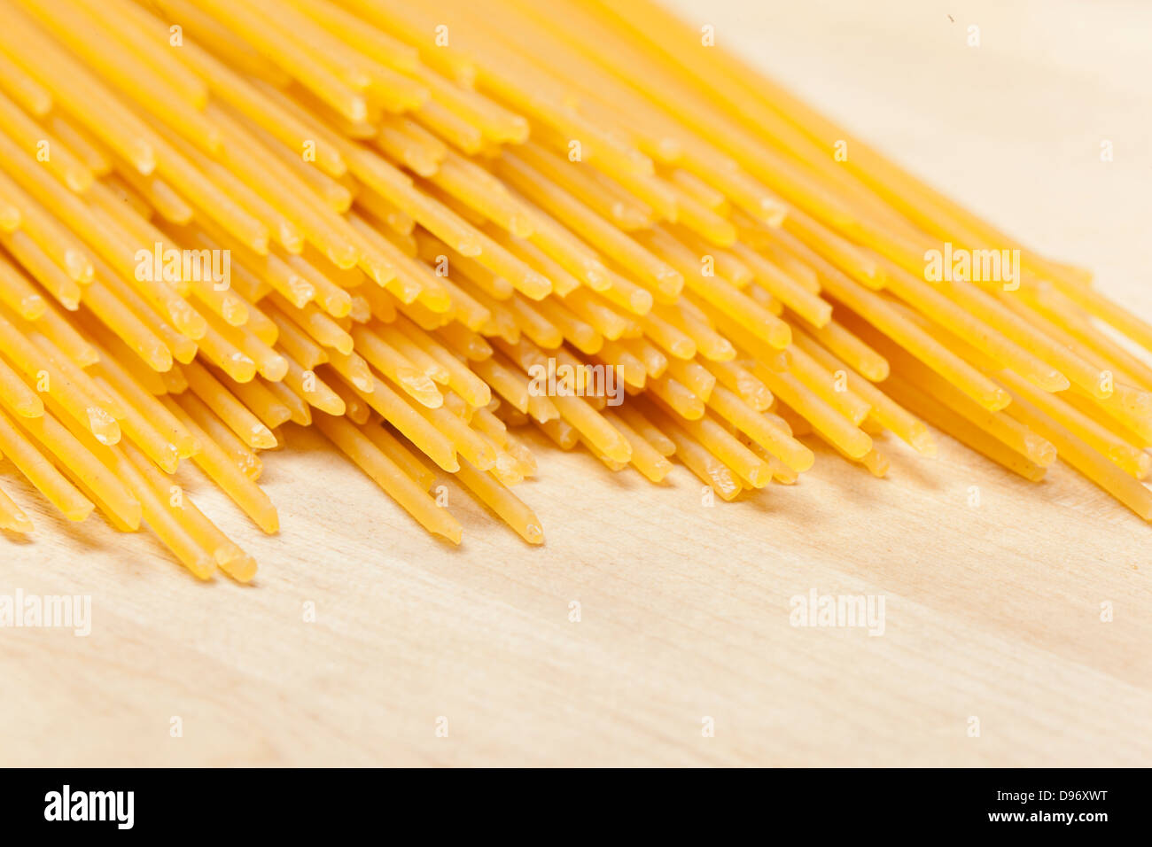 A Bundle of dry spaghetti ready to cook Stock Photo - Alamy