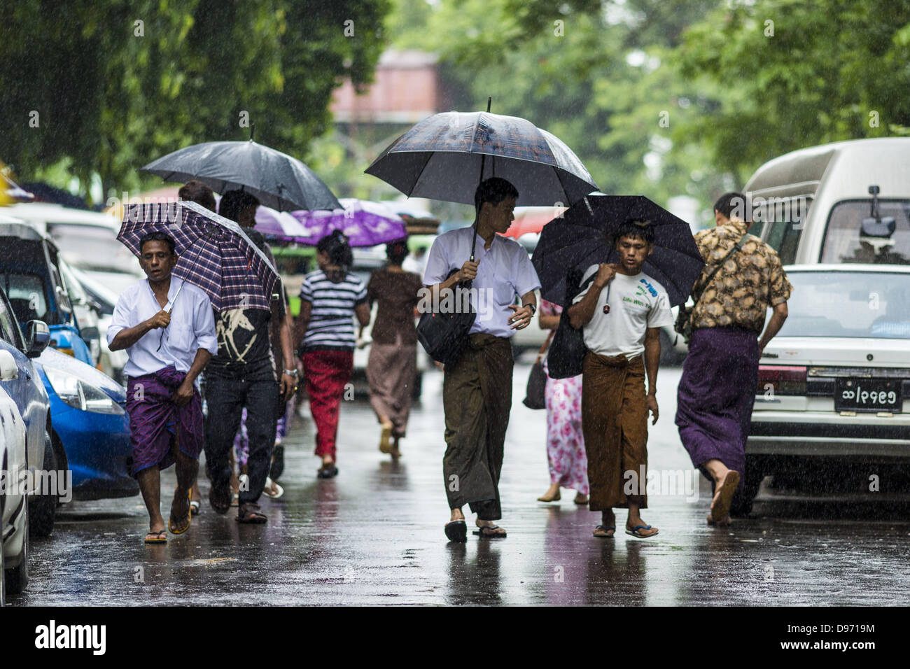 June 12, 2013 - Yangon, Union of Myanmar - Men wearing ''longyis,'' a ...