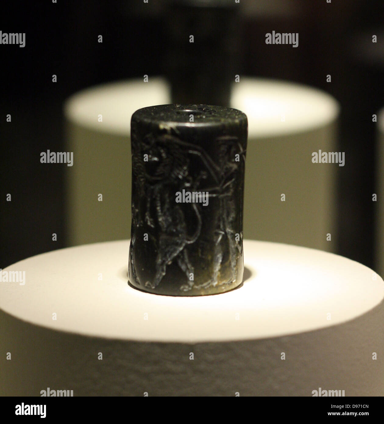 Babylonian cylinder seal Stock Photo - Alamy