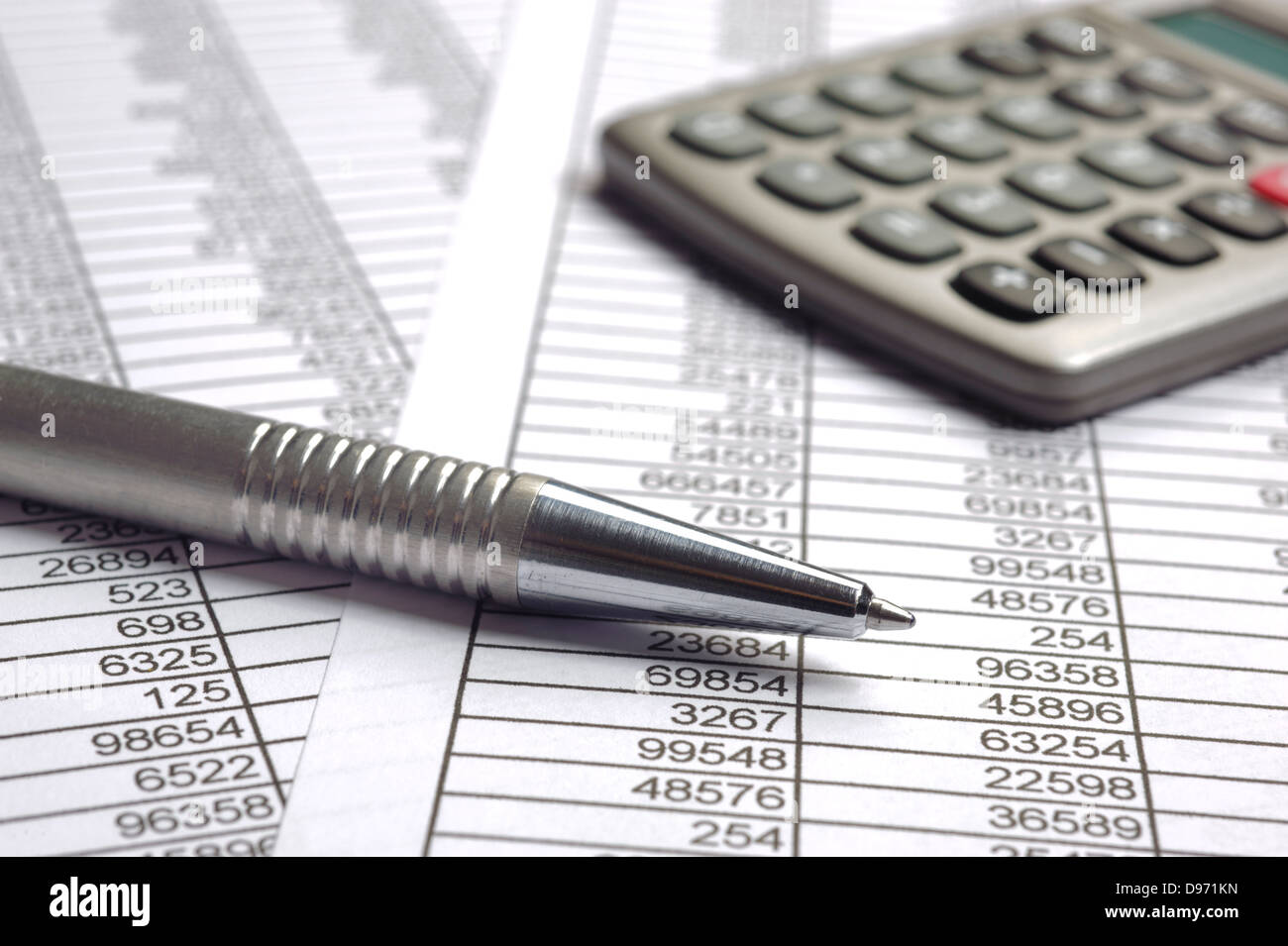 finance business calculation with pen and calculator Stock Photo - Alamy
