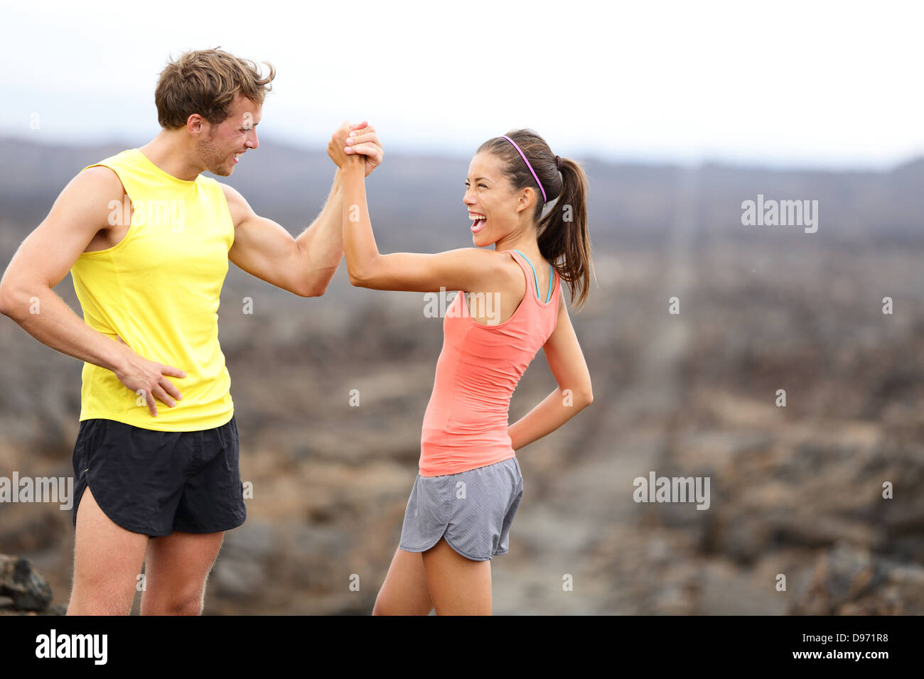 Fitness sport running couple celebrating cheerful and happy giving high ...