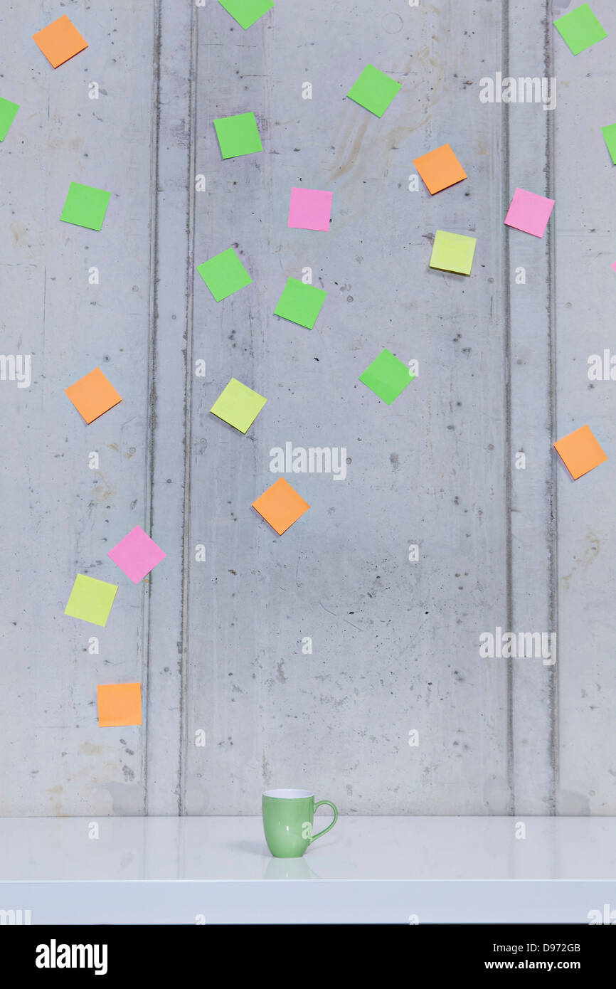 Germany, North Rhine Westphalia, Cologne, Adhesive notes stuck on wall ...