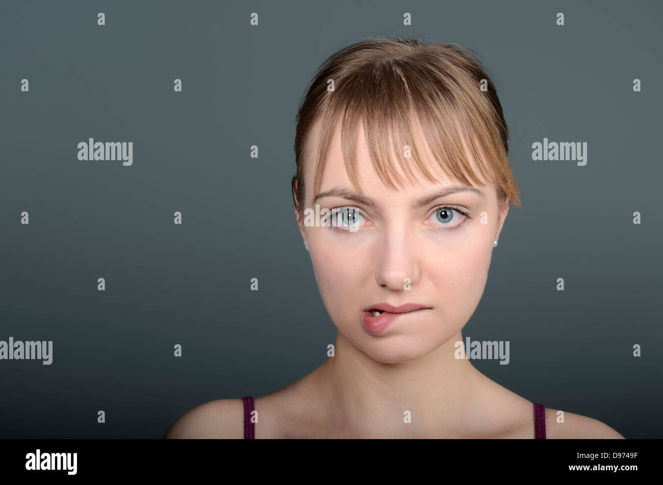 Biting lip anxious hi-res stock photography and images - Alamy