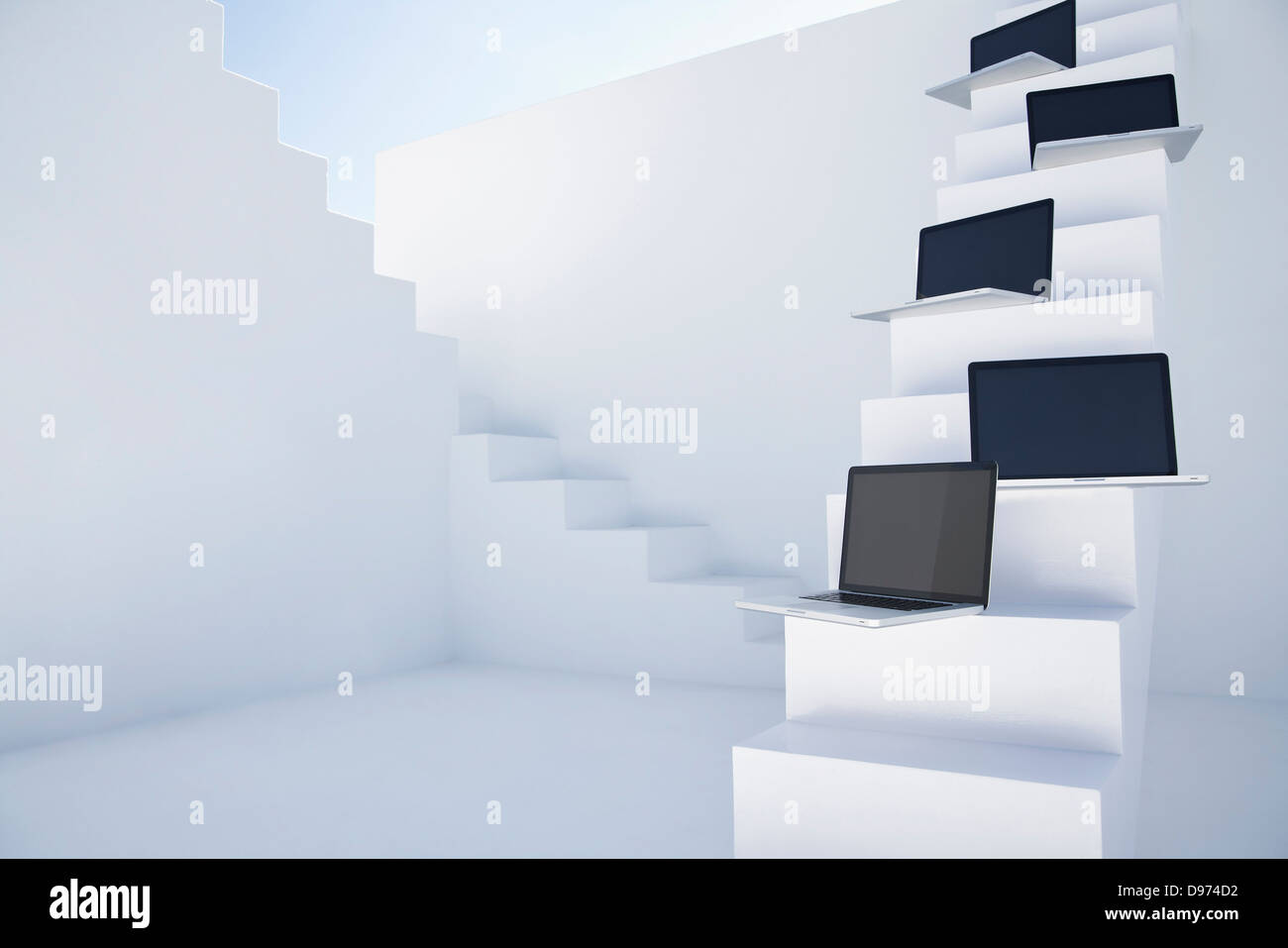 Laptops on white modern stairs Stock Photo - Alamy