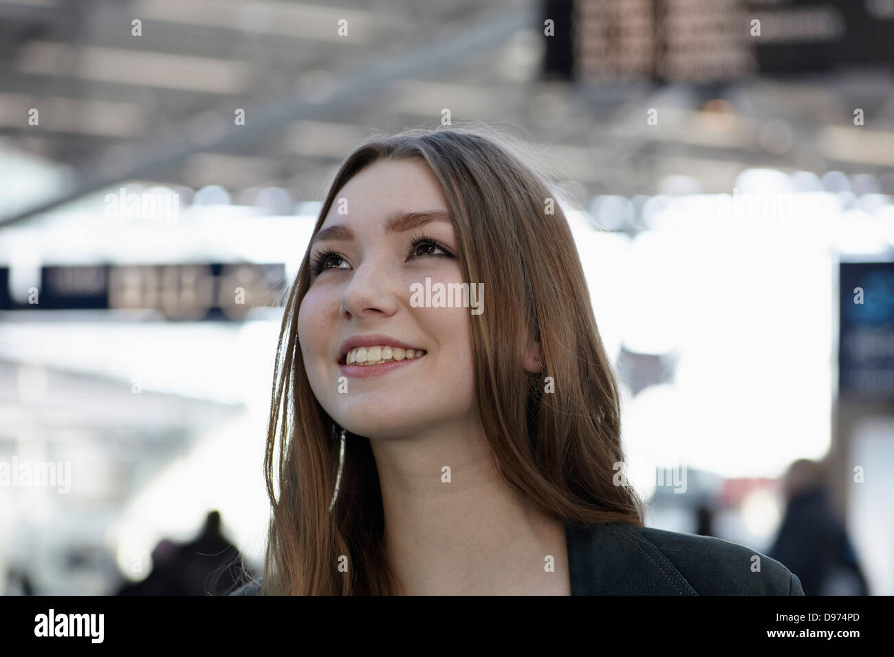 Germany, Cologne, Young woman at airport, smiling Stock Photo - Alamy