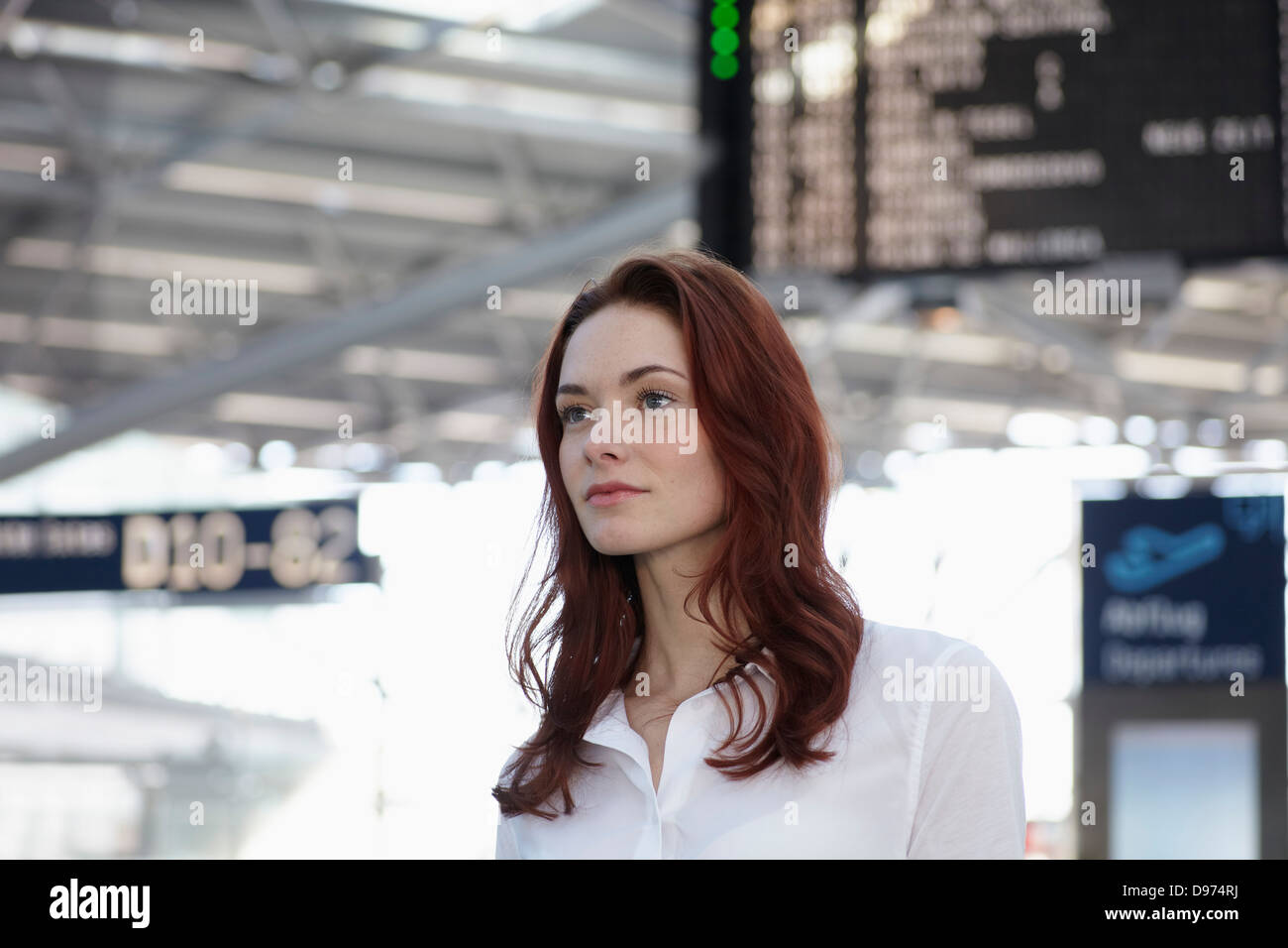 Germany, Cologne, Young woman at airport Stock Photo - Alamy