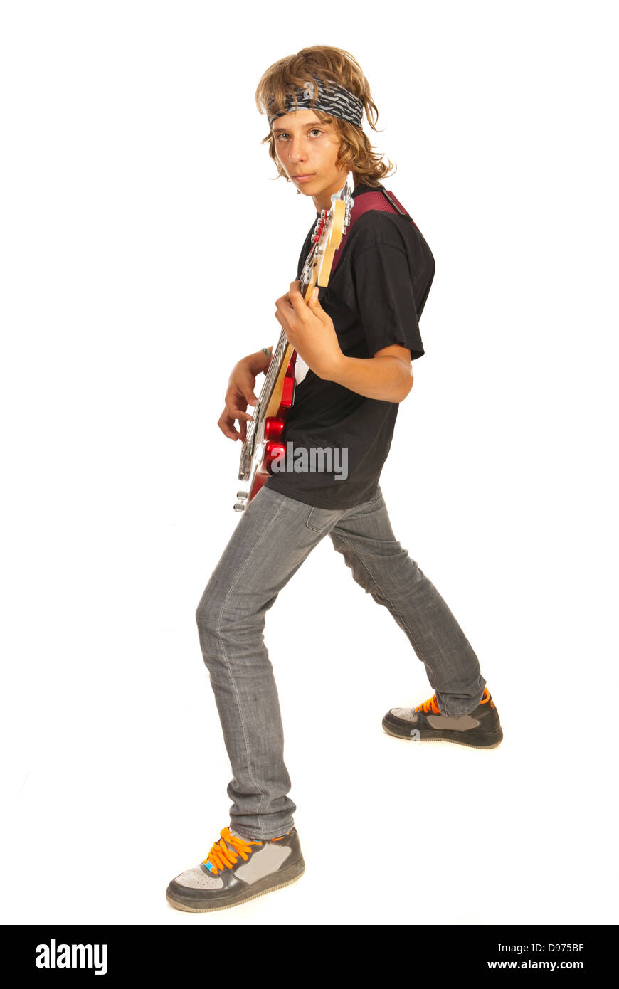 Teen boy rocker playing bass guitar isolated on white background Stock ...