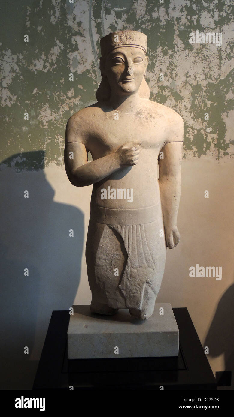 Male statue with rosette diadem. The loincloth and arm position ...