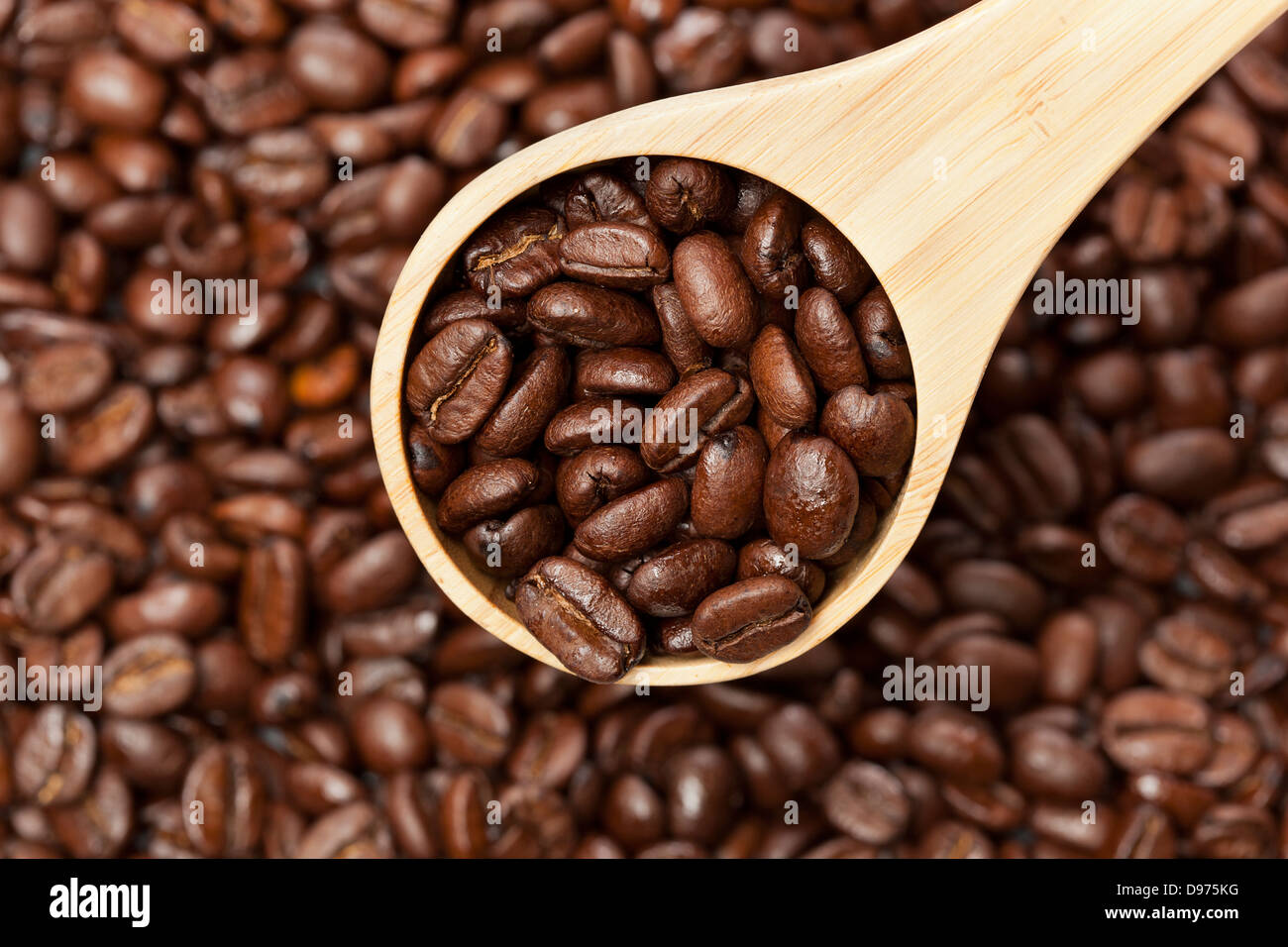 Black Organic Coffee Beans on a background Stock Photo - Alamy