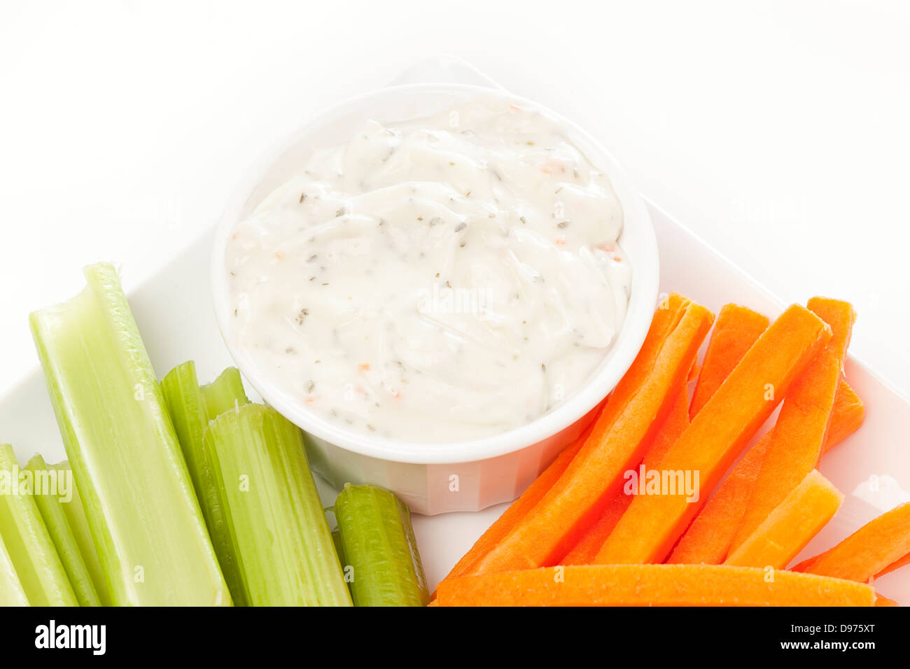 Ranch dressing with fresh carrots and celery Stock Photo - Alamy