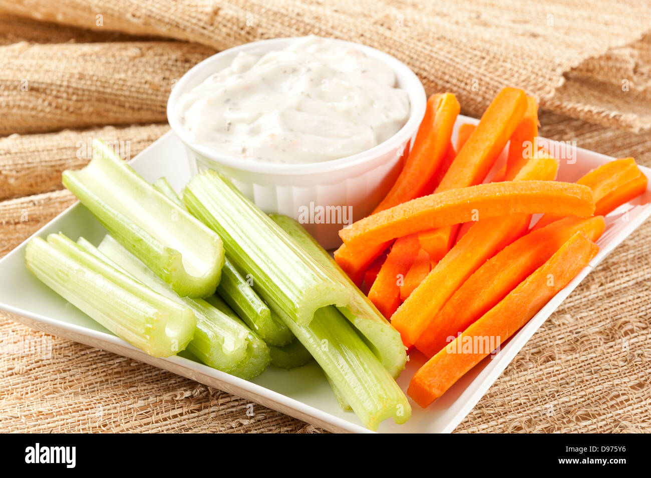 Ranch dressing with fresh carrots and celery Stock Photo - Alamy