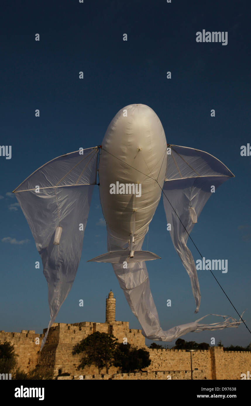 Huge helium kite flying in the sky in front of David Citadel in the old ...