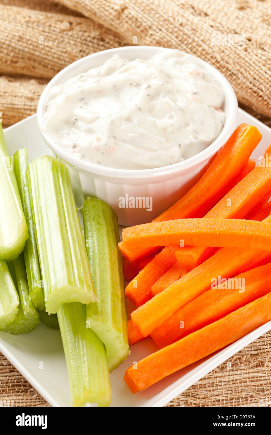 Ranch dressing with fresh carrots and celery Stock Photo - Alamy