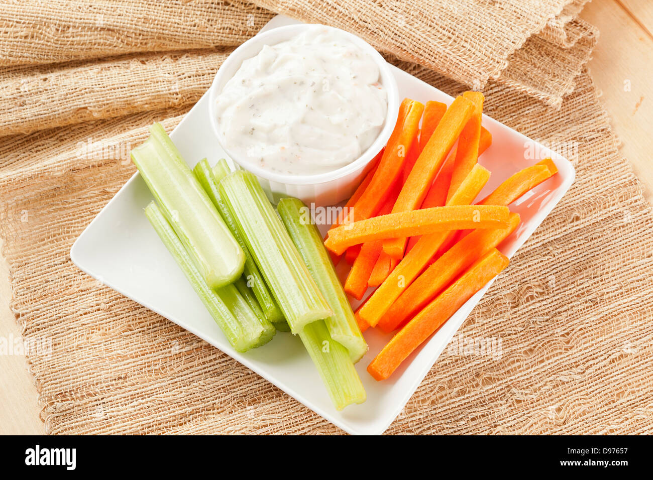Ranch dressing with fresh carrots and celery Stock Photo - Alamy