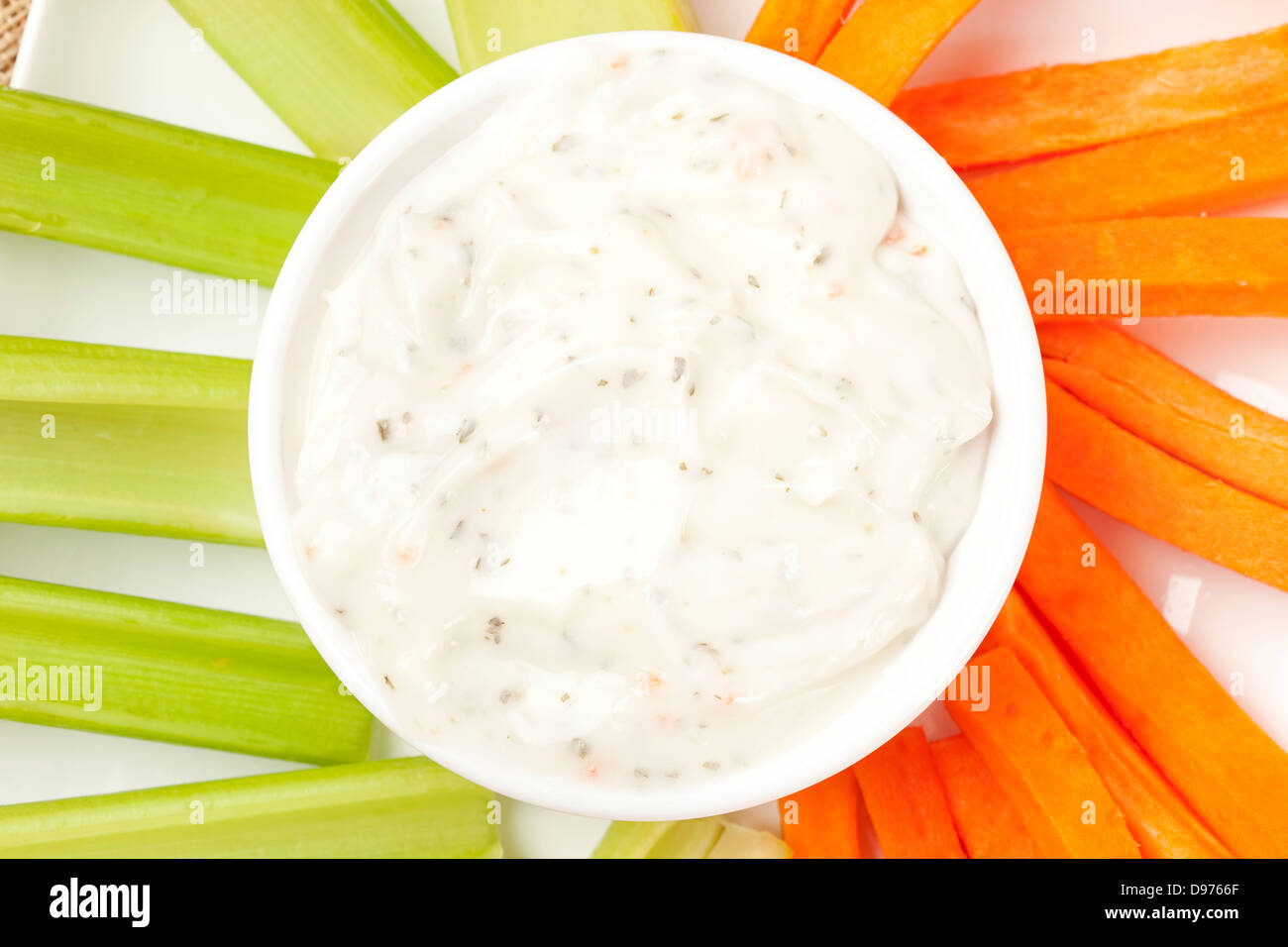 Ranch dressing with fresh carrots and celery Stock Photo - Alamy