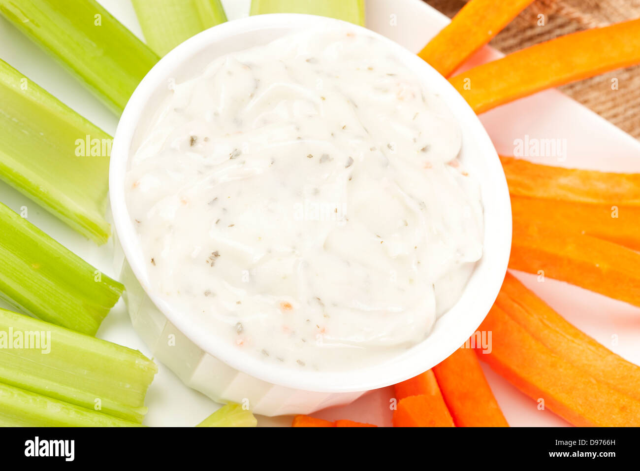 Ranch dressing with fresh carrots and celery Stock Photo - Alamy