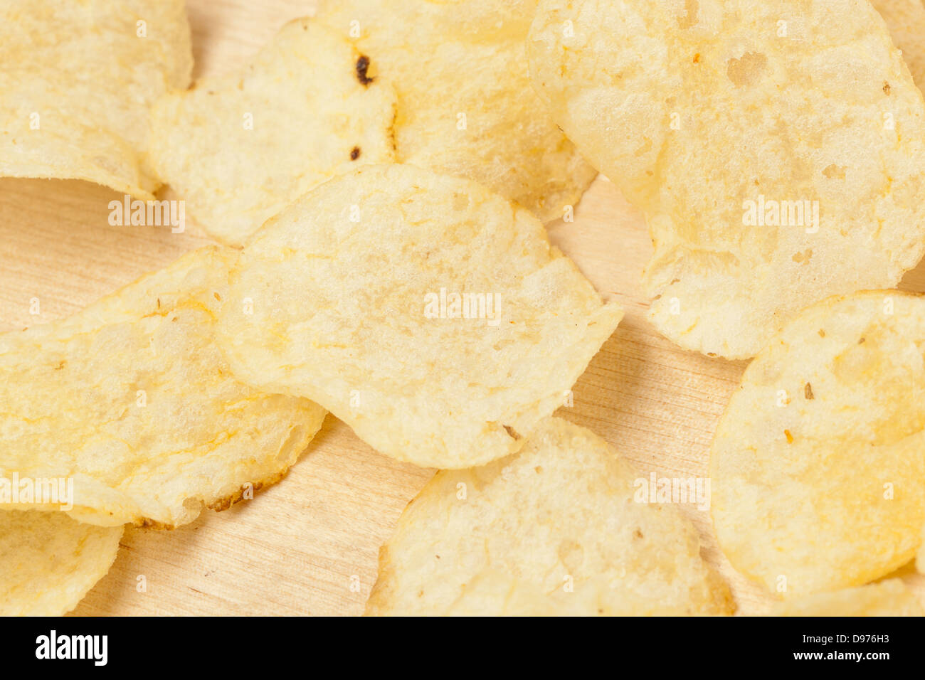 Crispy Fresh Potato Chips on a background Stock Photo - Alamy