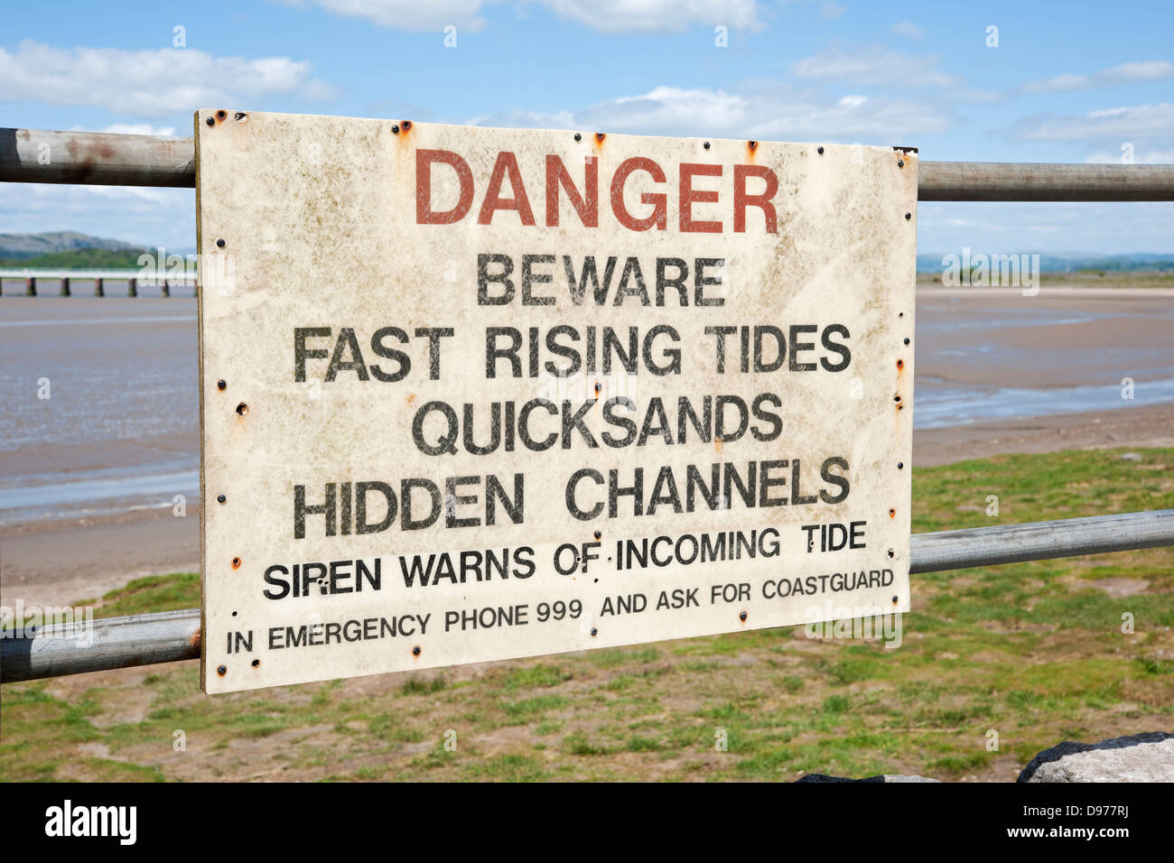 Close up of Danger warning sign tide quicksand beach Arnside Cumbria ...