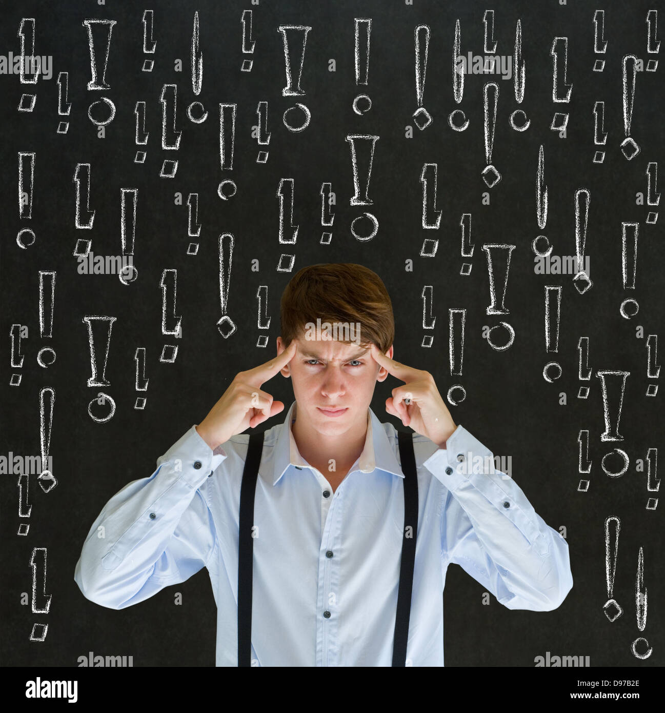 Thinking business man with chalk exclamation marks on blackboard ...