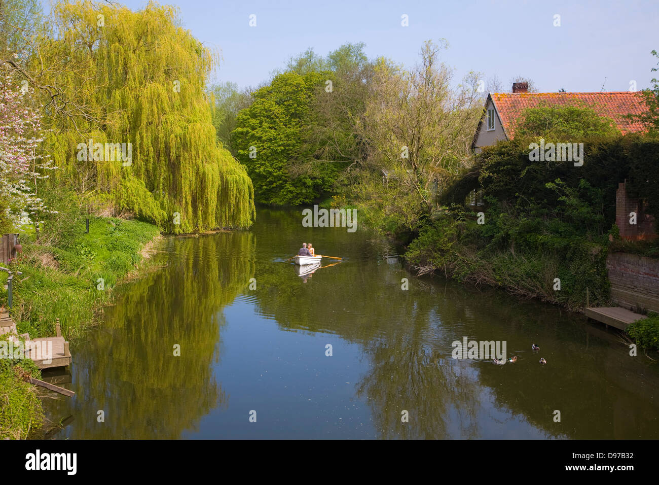 Rowing boat on the River Stour at Bures, Suffolk Essex border, England ...