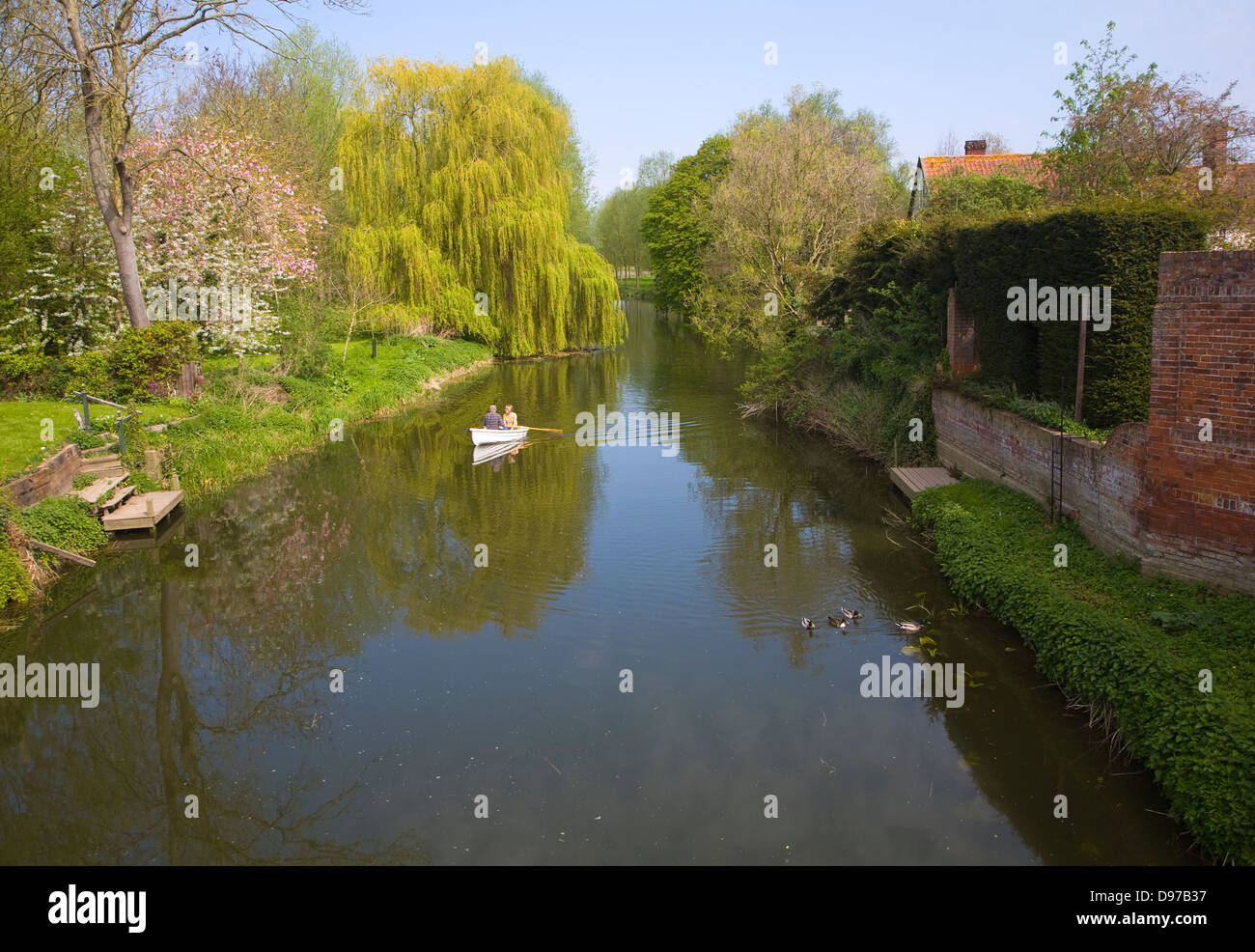 Rowing boat on the River Stour at Bures, Suffolk Essex border, England ...
