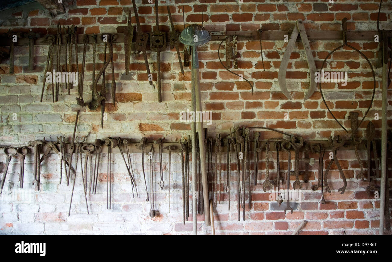 Old rusty farming tools at Helmingham Hall, Suffolk, England Stock ...