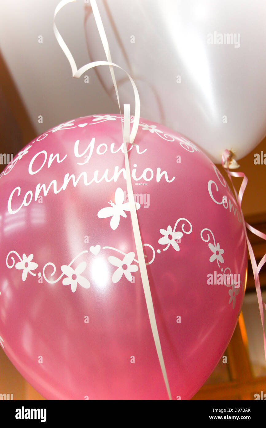 First Holy Communion celebration balloons Stock Photo - Alamy