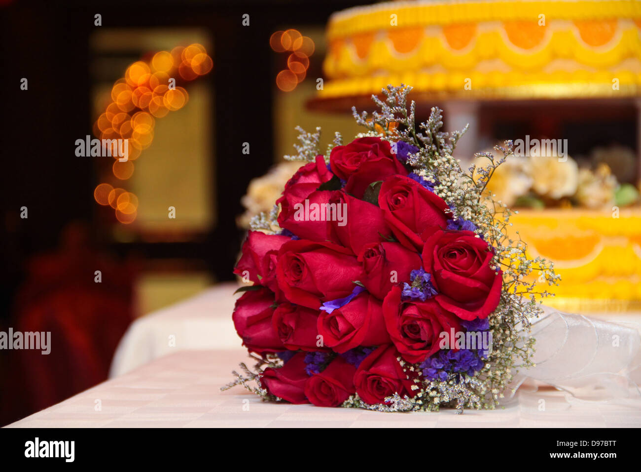 A hand bouquet of red roses in a table top setup Stock Photo - Alamy